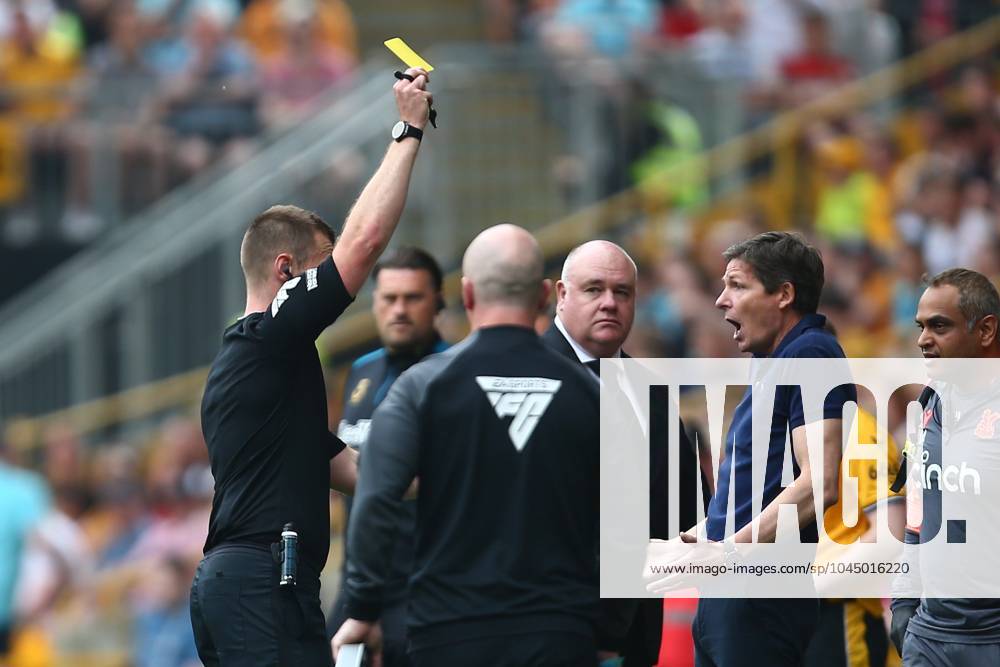 Referee Tom Bramall shows Crystal Palace manager Oliver Glasner a ...