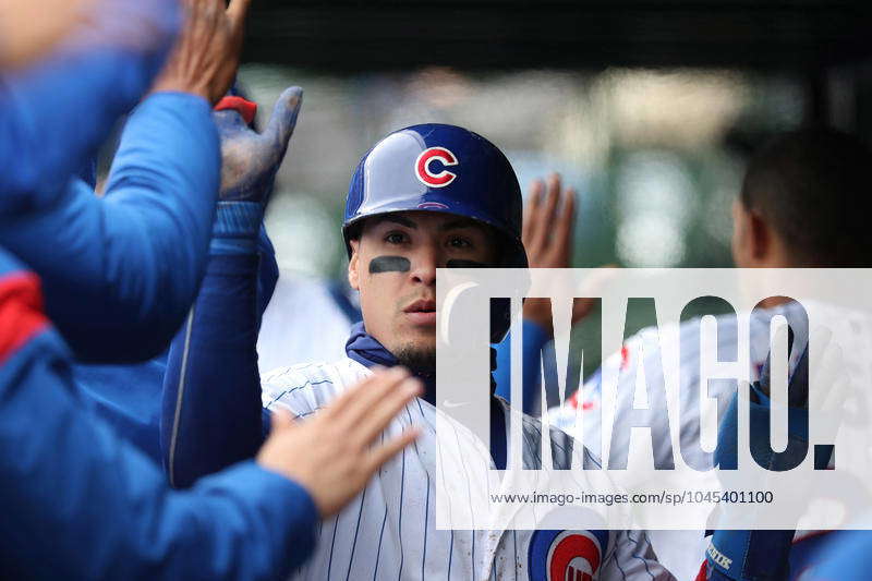 In a May 2018 file image, the Chicago Cubs Javier Baez is congratulated ...