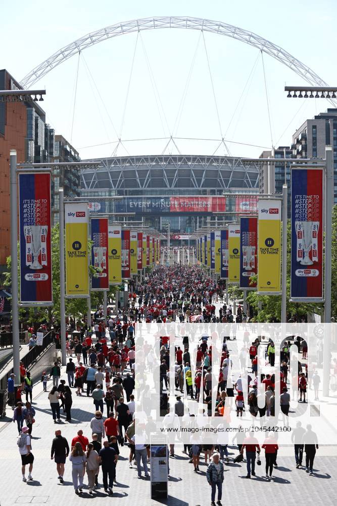 Fans make their way down Olympic Way towards Wembley Stadium with Sky ...