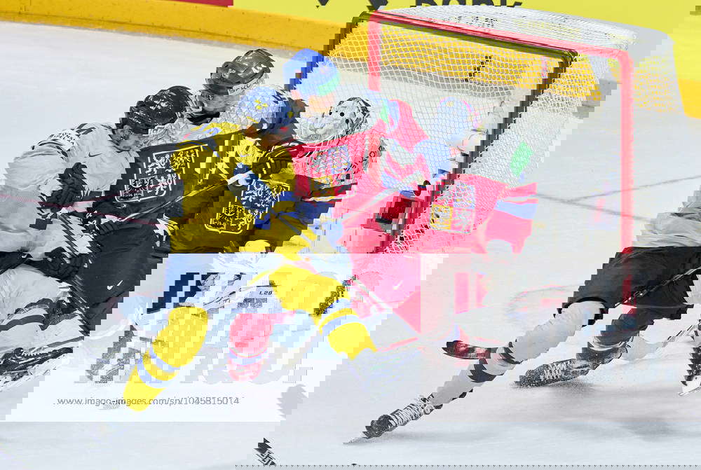 Jan Rutta CZE Nr. 44 Lukas Dostal goalie CZE Nr. 1 compete, zweikampf, fight for the puck against