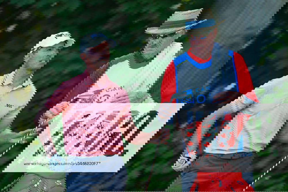 RBC Canadian Open Mike Weir of Canada hands his club to his caddie on ...