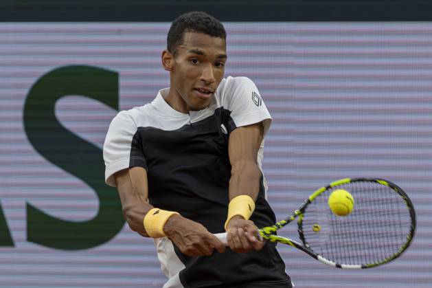 Roland Garros 2024 - Day 7 Felix Auger-Aliassime is returning the ball against Ben Shelton during