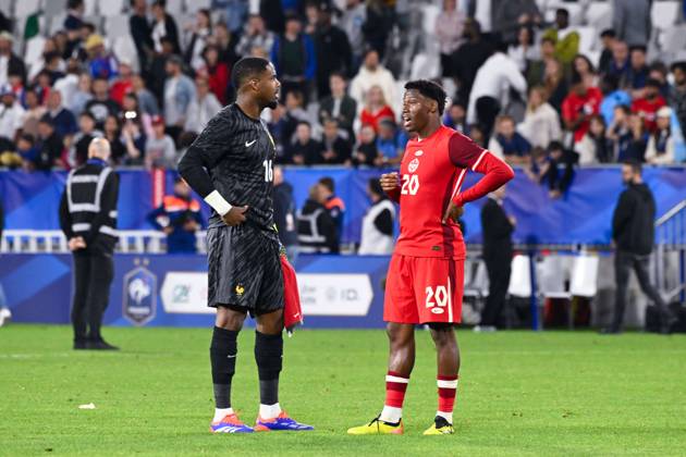 Mike Maignan talks with Jonathan DAVID during the Friendly match ...