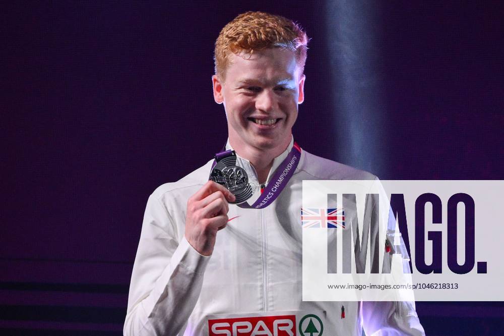 Charles Dobson of Great Britain shows medal during the medal ceremony ...