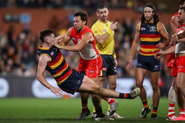 AFL CROWS SWANS, Mark Keane of the Crows clashes with Tom Papley of the ...