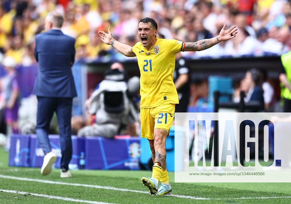 Nicolae Stanciu of Romania gestures to the crowd after being ...