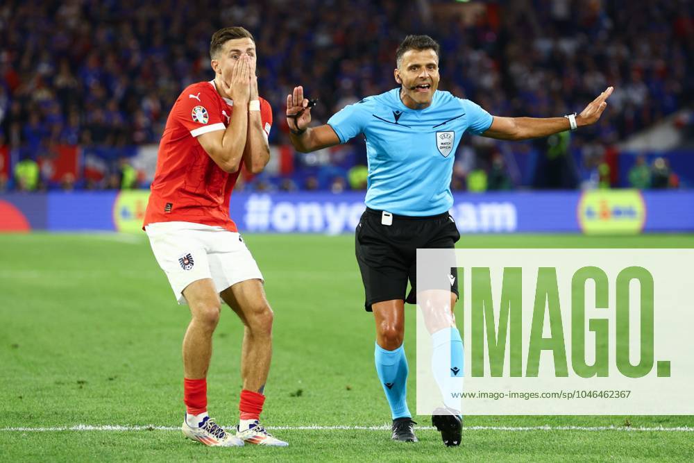 Referee Jesus Gill Manzano waves away a penalty appeal Austria v France ...