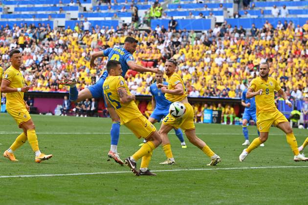 Roman YAREMCHUK UKR , header,action,duel against Andrei BURCA ROM,left ...