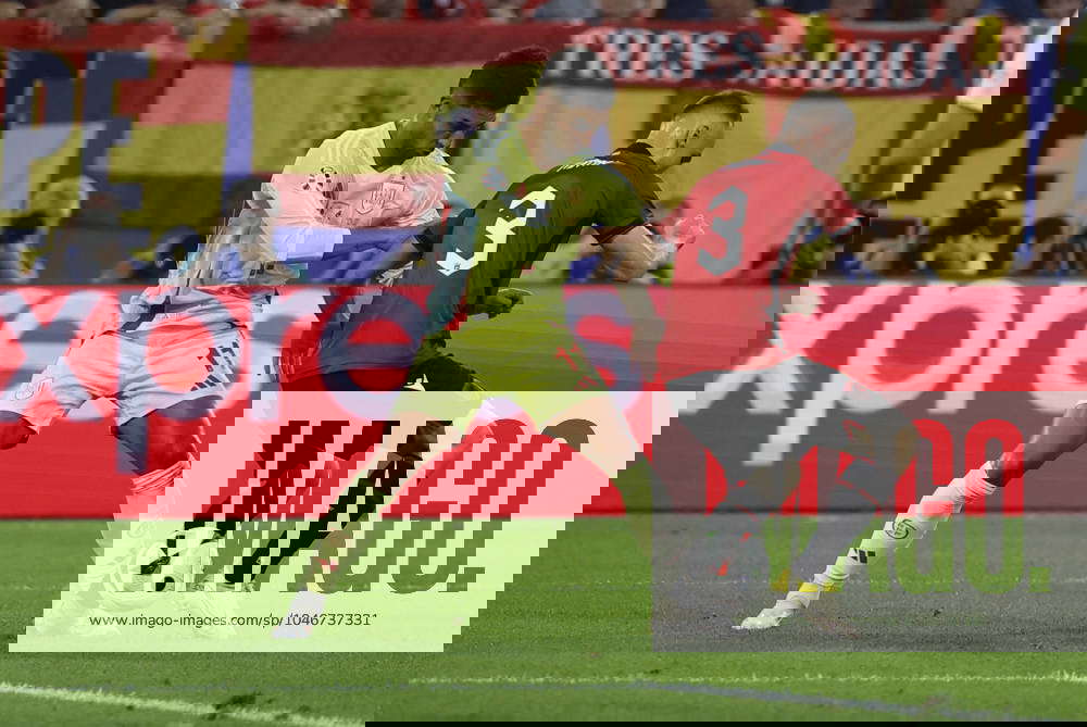 Albania s Mario Mitaj (R) in action against Spain s Ferran Torres (L ...