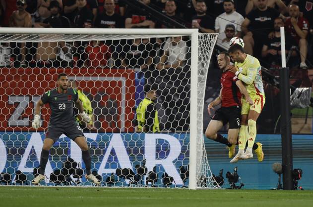 Albania s Mario Mitaj (R) in action against Spain s Ferran Torres (L ...
