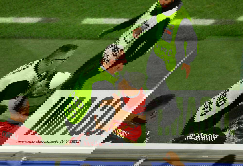 A pitch invader is caught by a steward Albania v Spain, UEFA European ...