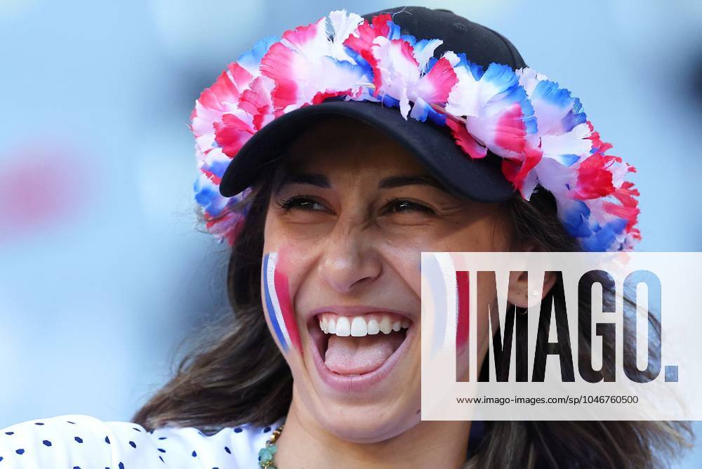 A French fan with face paint looks on ahead of the game France v Poland ...