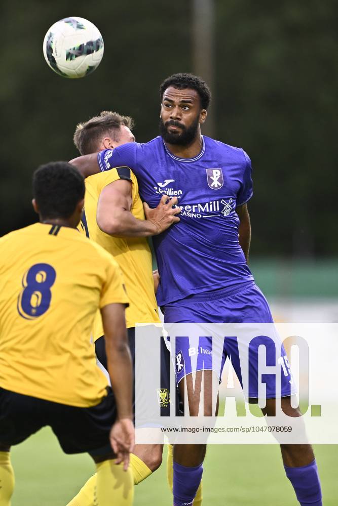STVV s Bruno Godeau and Patro Eisden s Elisha Sam Bruce fight for the ...