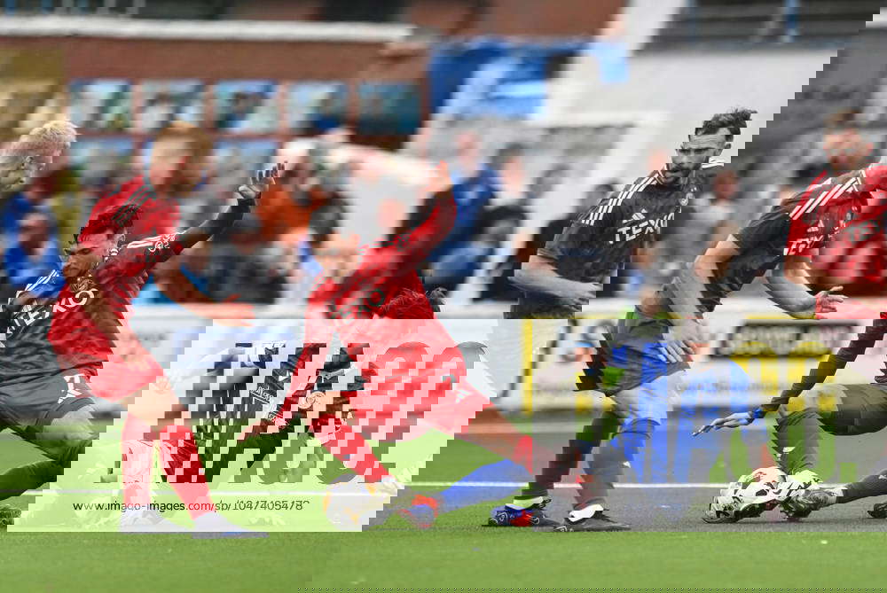 Reece Lyon of Queen of the South brings down Jamie McGrath of Aberdeen ...