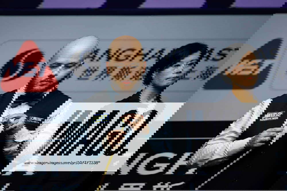 SHANGHAI, CHINA - JULY 16: Luca Brecel of Belgium chalks the cue in the ...