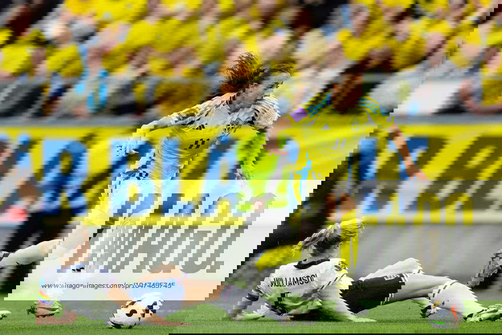 Leah Williamson of England and Rusul Rosa Kafaji of Sweden during the ...