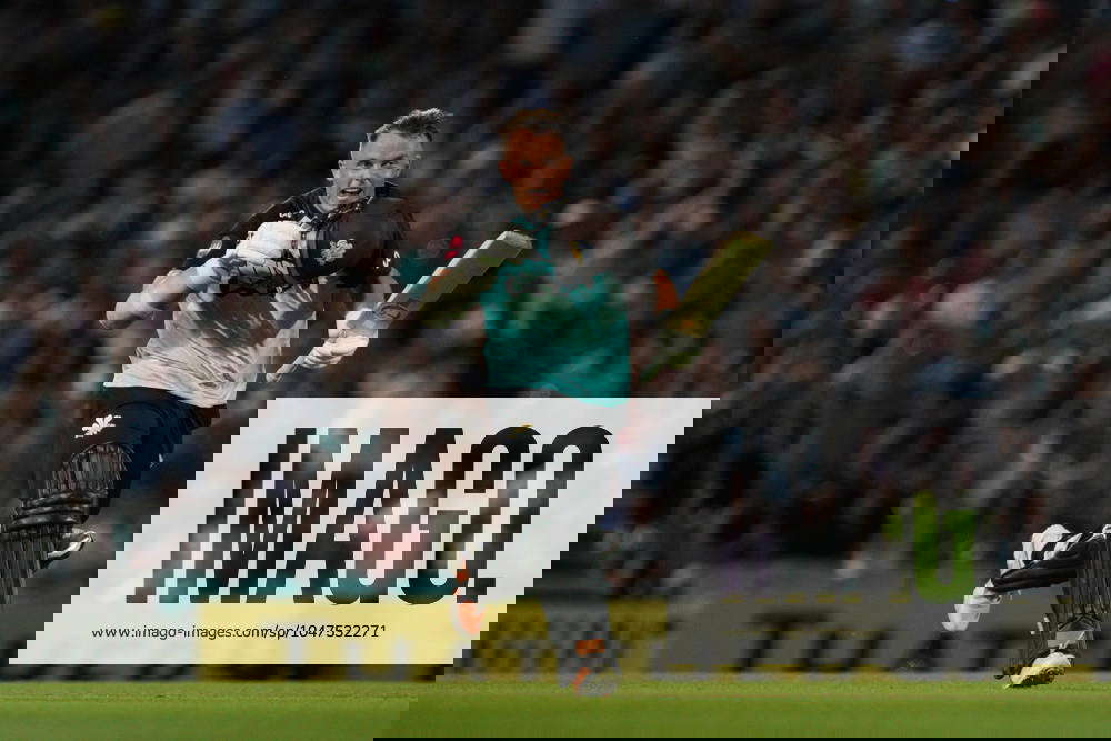 Sam Curran of Surrey raises his bat as he reaches 100 during the ...