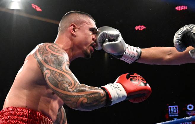 BOXING HUNI PILCHER, Clay Waterman (left) is punched by Lucas Miller ...
