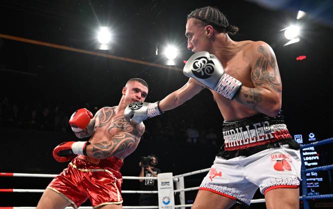 BOXING HUNI PILCHER, Clay Waterman is punched by Lucas Miller during ...