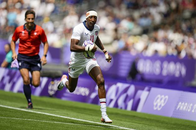 Perry Baker of Team USA runs in to score a try during their men s Pool ...