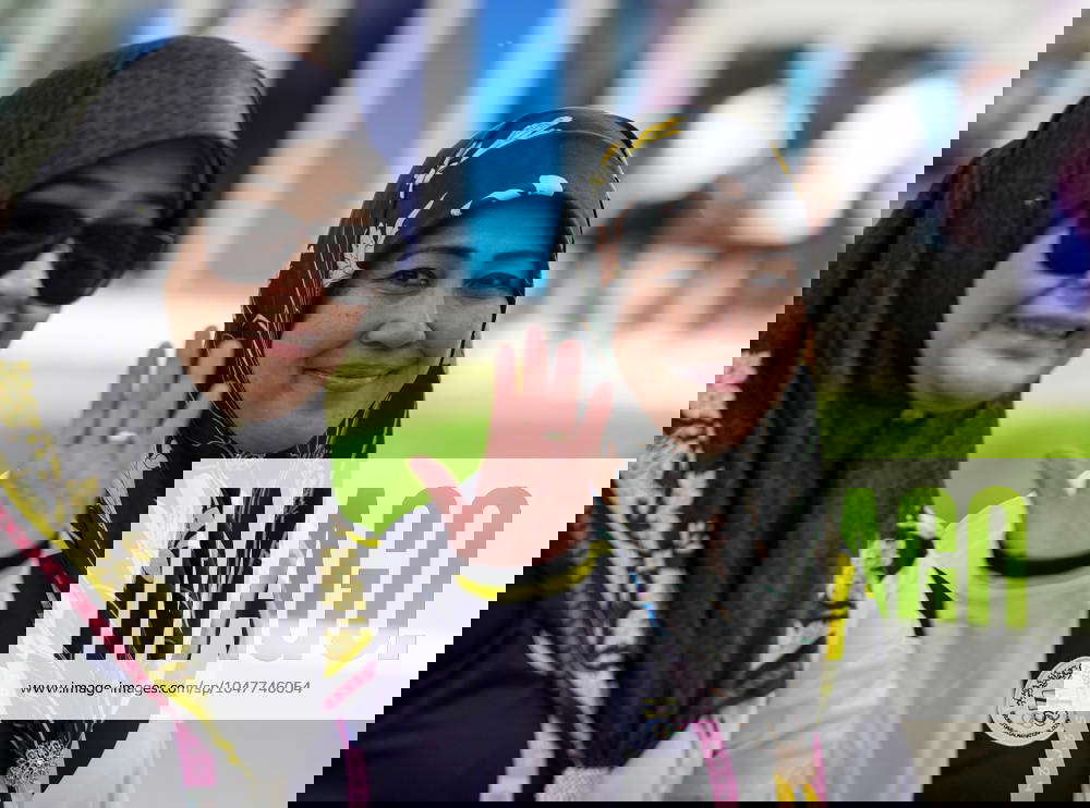 Two women from Brunei Darussalam at the Olympic Village during the ...