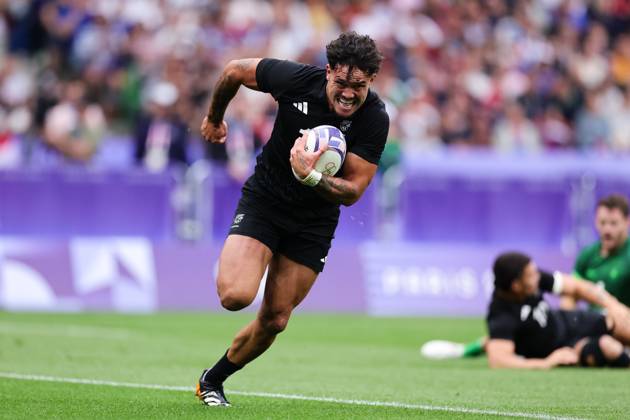 PARIS, FRANCE - JULY 27: Moses Leo (11) of Team New Zealand runs in for ...