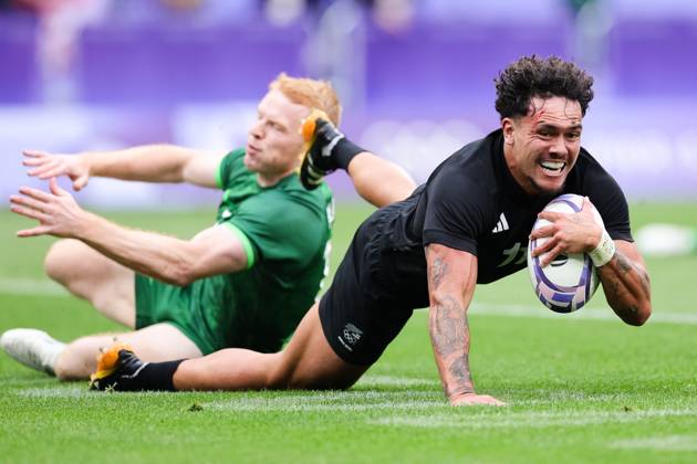 PARIS, FRANCE - JULY 27: Moses Leo (11) of Team New Zealand runs in for ...