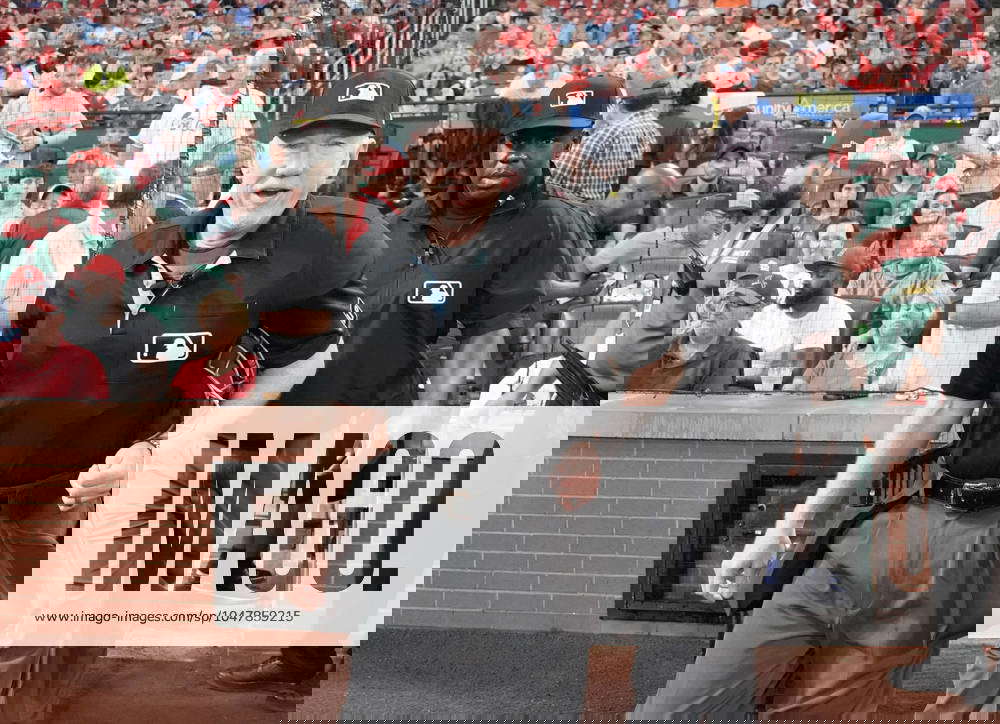 Major League umpire Lance Barksdale leads his crew to the field for a ...