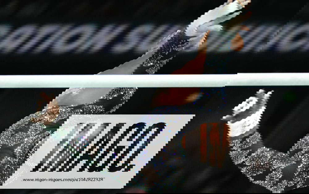 USA s Simone Biles turns and reaches during her routine on the Uneven ...