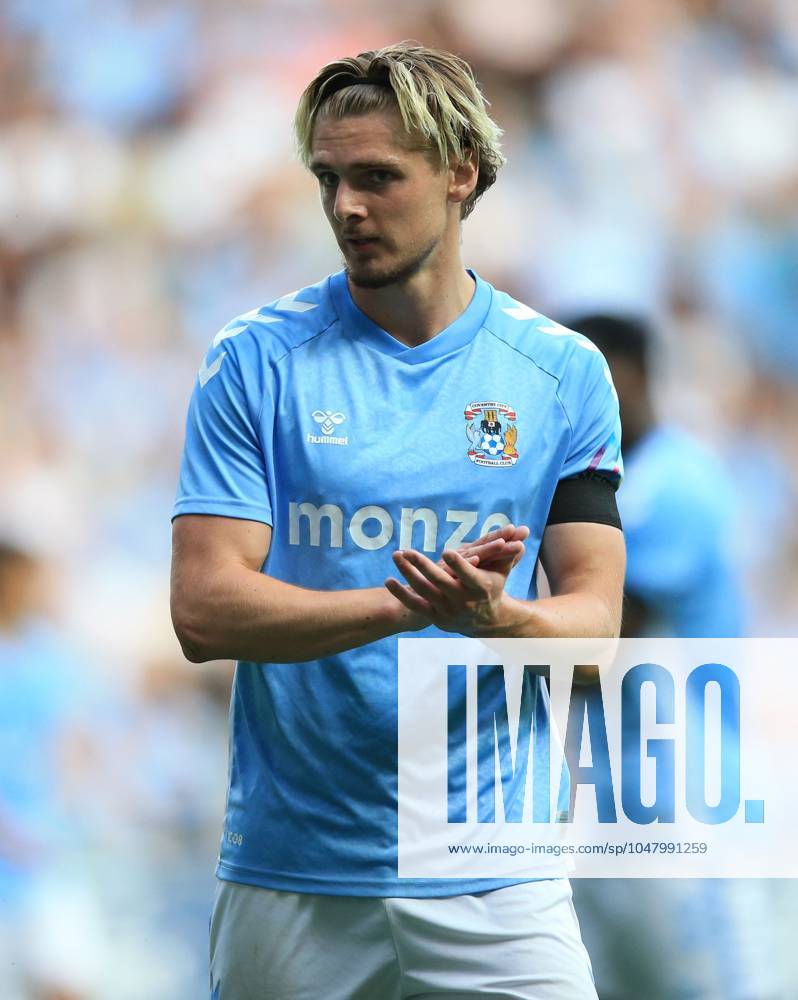 New signing Jack Rudoni of Coventry City claps to fans as he walks to ...