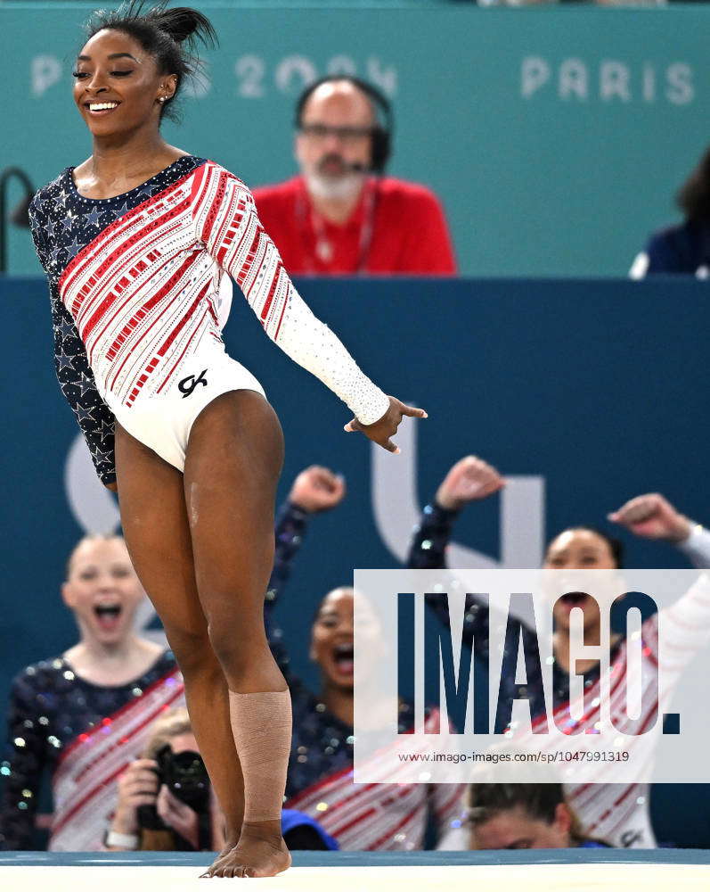 PARIS, Teammates cheer as Simone Biles of the Unites States finishes ...