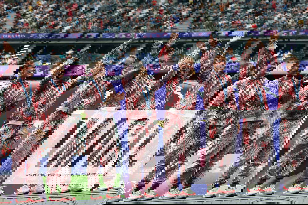 Members of the Canada female rugby team stand on the podium after ...