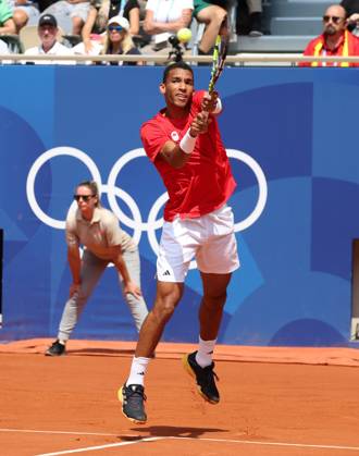 Canada s Felix Auger Aliassime plays a backhand in his Men s Singles Semi-Final match against
