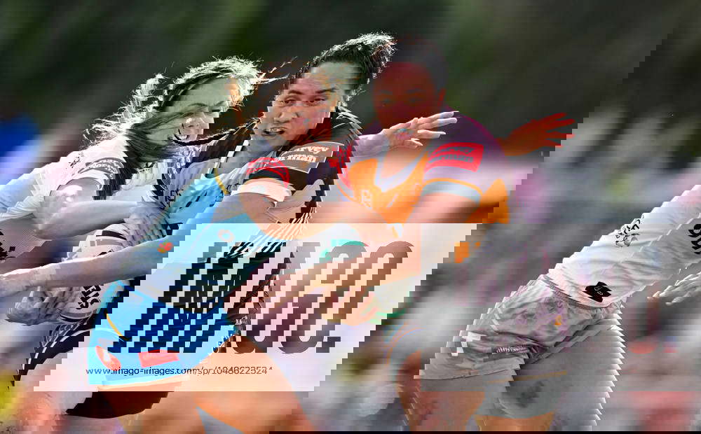 NRLW BRONCOS TITANS, Tazmin Rapana (right) of the Broncos gets past ...