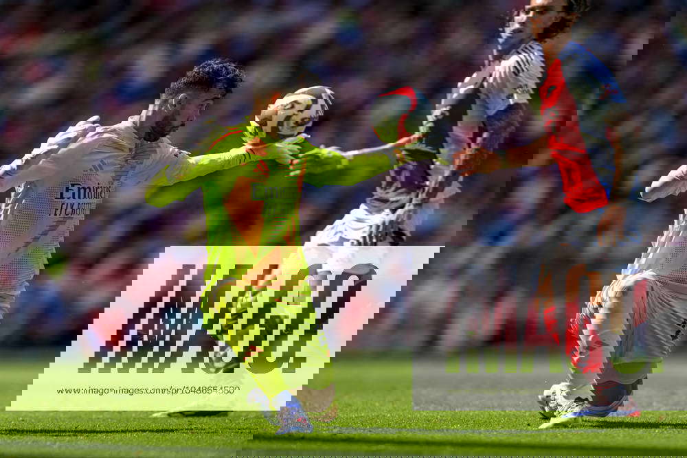 David Raya of Arsenal FC gats a hand to the shot by Ernest Nuamah of ...