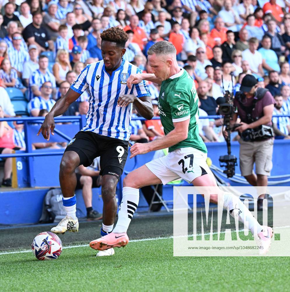 Jamal Lowe of Sheffield Wednesday and Adam Forshaw of Plymouth Argyle ...