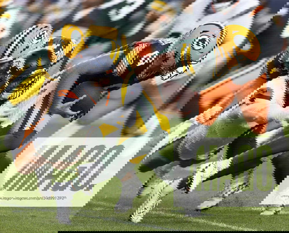 August 18, 2024, Denver, Colorado, USA: Packers QB SEAN CLIFFORD runs from a tackle after picking
