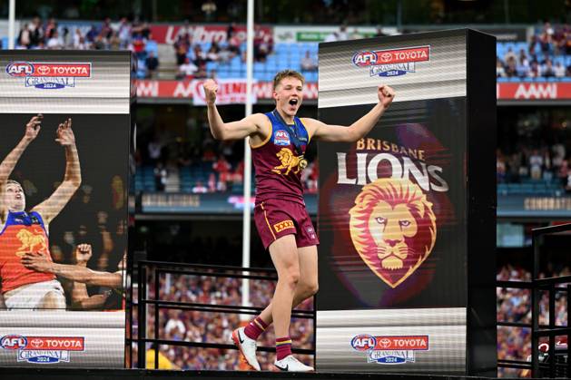 AFL GRAND FINAL, Logan Morris of the Lions celebrates with Hugh ...