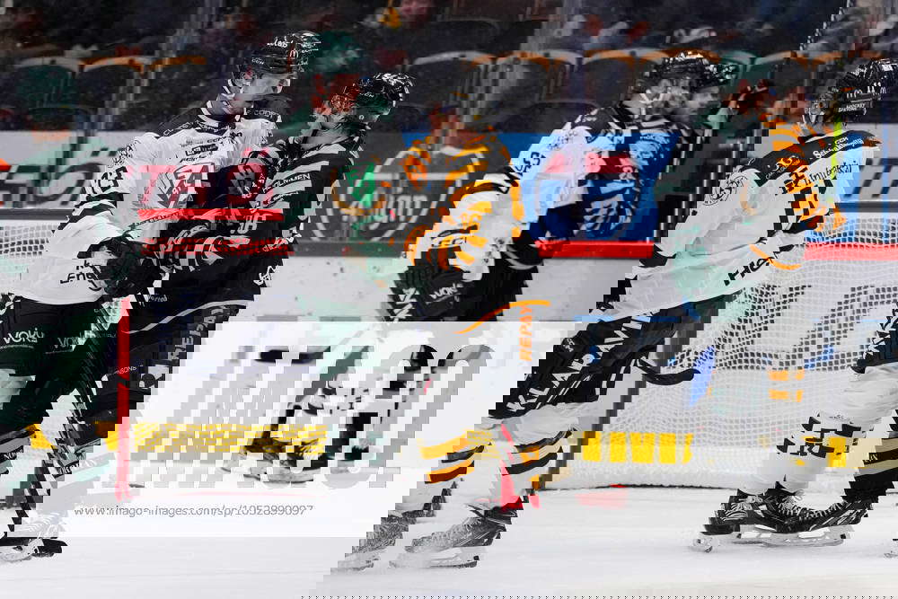 241024 Färjestads Adam Ollas Mattsson and Skellefteas Rickard Hugg during the ice hockey match in