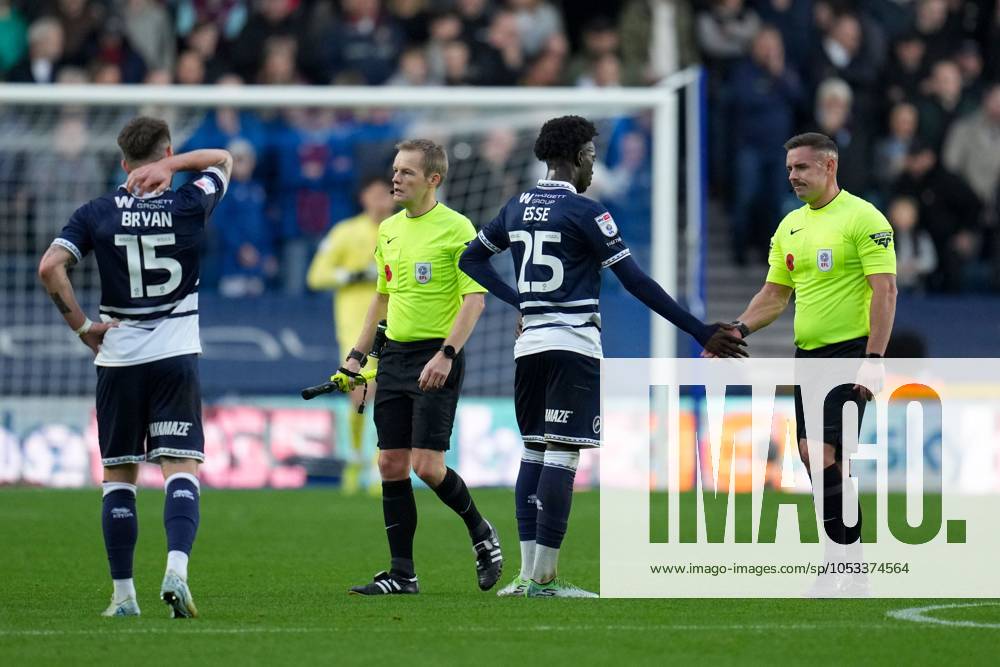 Injured Assistant Referee Matthew Smith shakes hands with Romain Esse ...