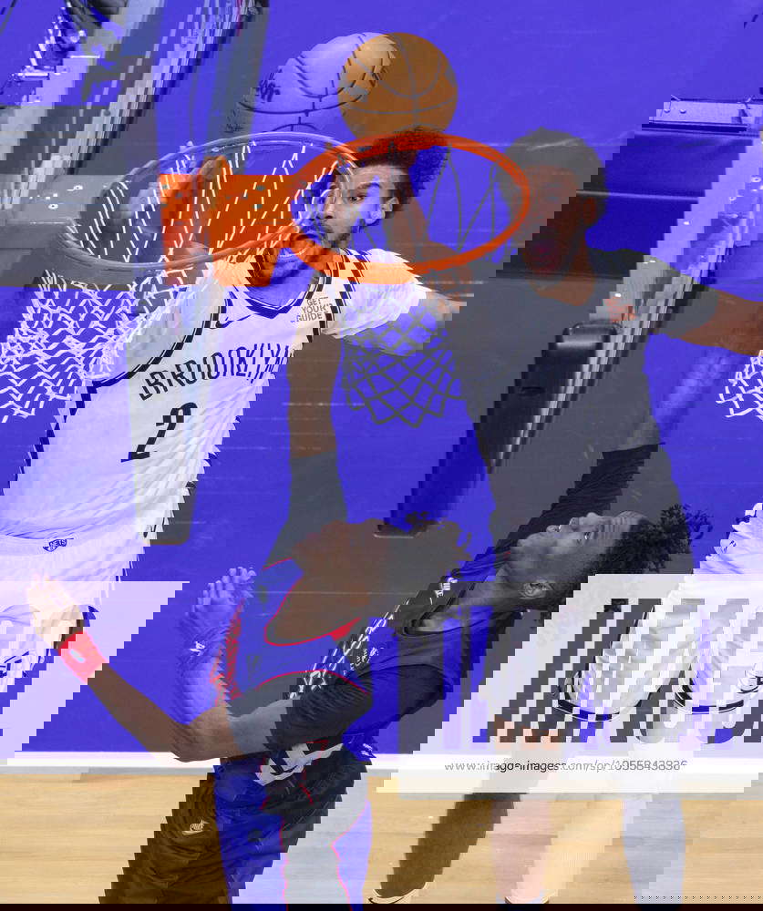 (241220) -- TORONTO, Dec. 20, 2024 -- Ja Kobe Walter (bottom) of Toronto Raptors goes up for a