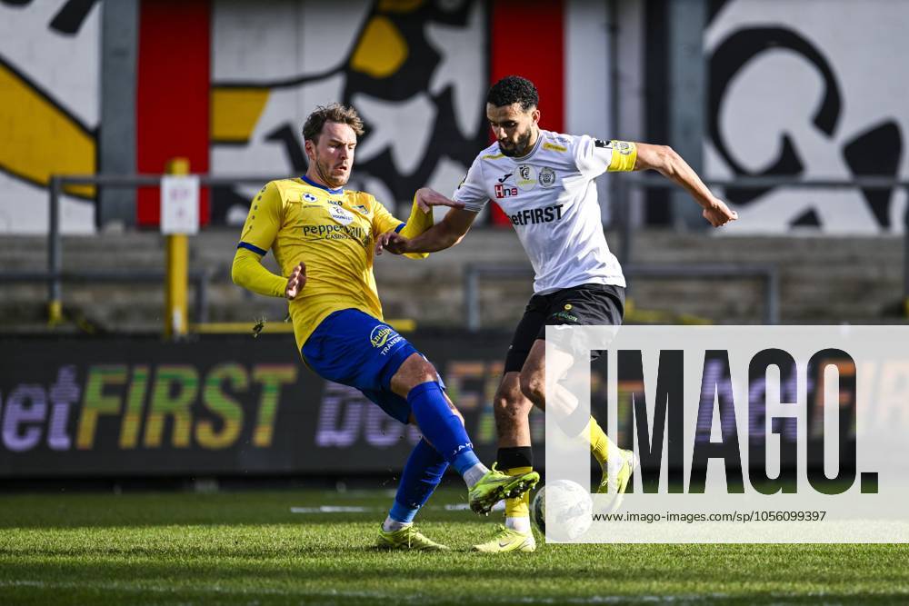 Beveren s Lennart Mertens and Lokeren s Naim Boujouh pictured in action ...