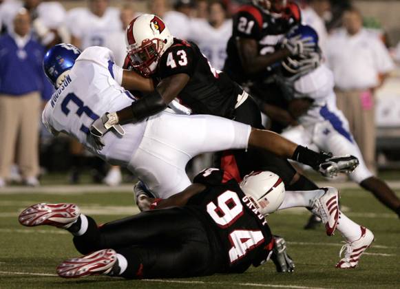 Kentucky quarterback Andre Woodson gets drilled by Abe Brown Kentucky ...