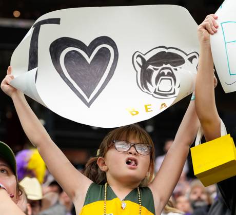 December 31, 2024, Houston, Texas, USA: A young Baylor fan holds up a ...