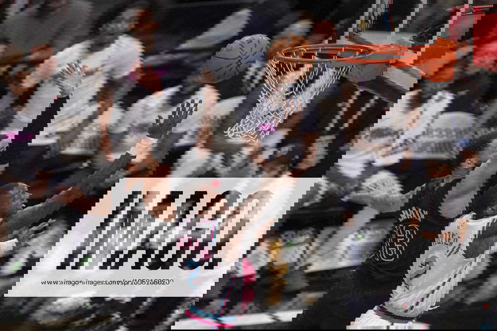 Tyrese Martin of Brooklyn vies for the ball with Terry Rozier of the ...