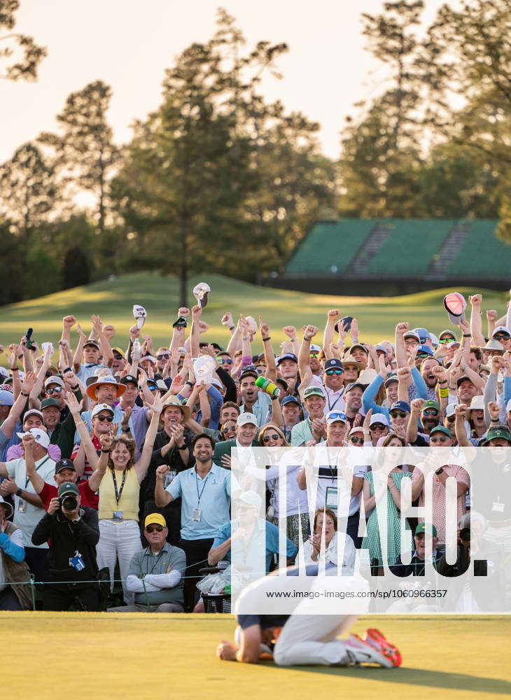 250413 Patrons celebrate as Rory McIlroy of Northern Ireland sinks his ...