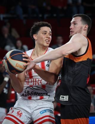 Spirou s Adedayo Polet and Leuven s Noah Bauman fight for the ball during a basketball match