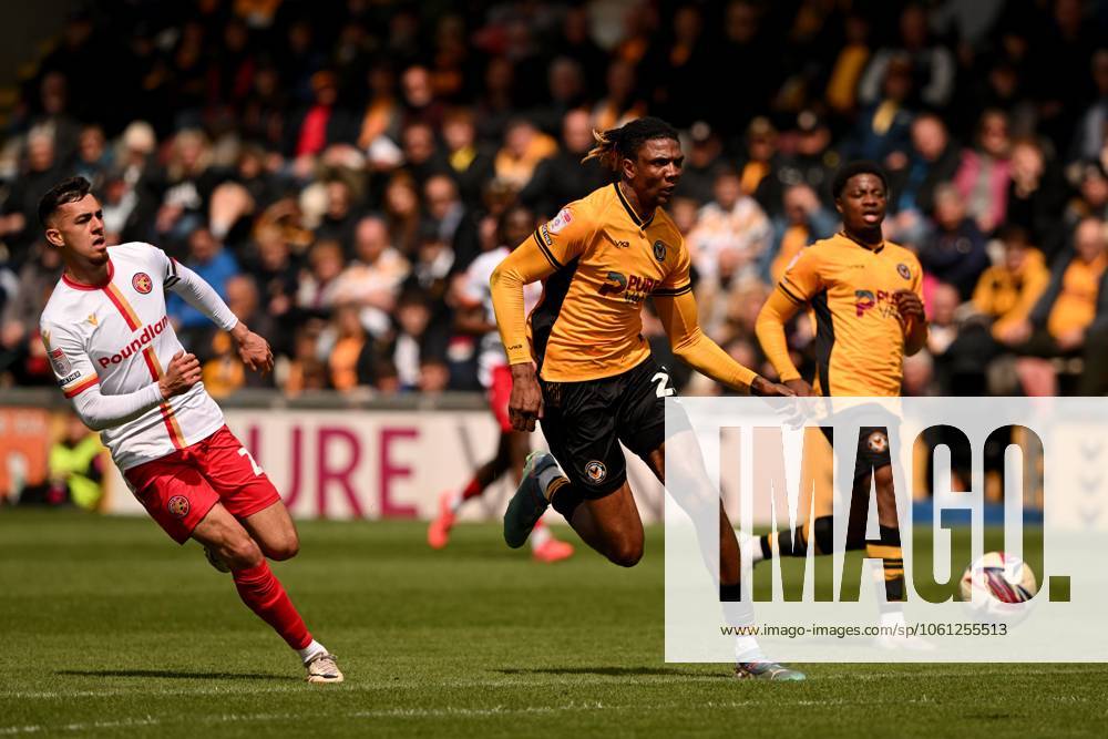 Kyle Hudlin of Newport County battles for the ball with Taylor Allen of ...