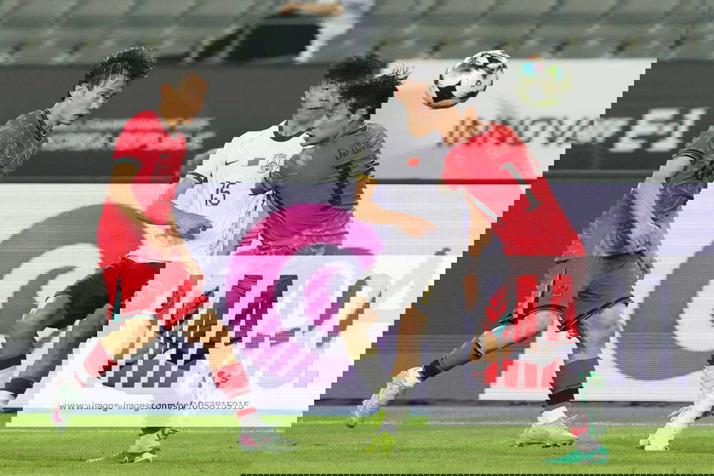 YONGIN, SOUTH KOREA - JULY 07: Wang Yudong 15 of China vies for the ...