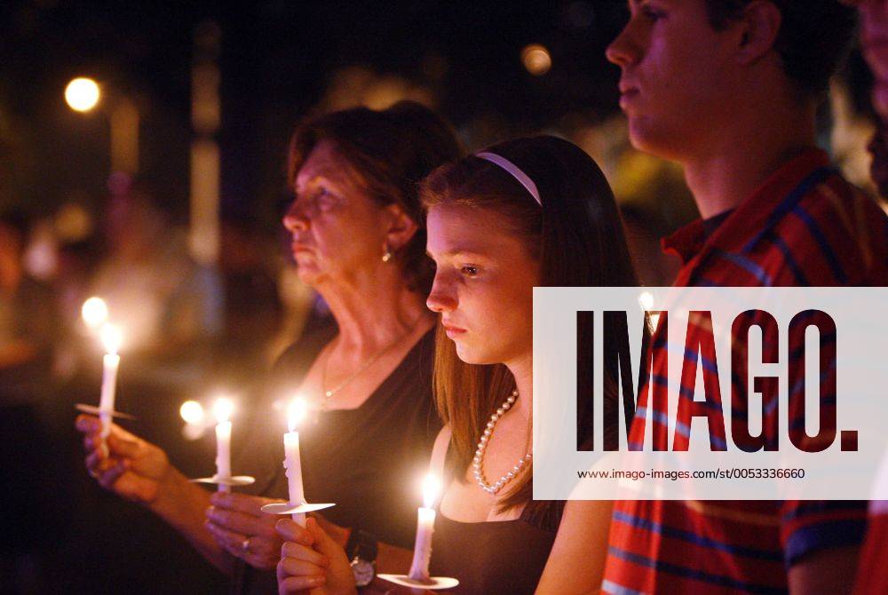 Family members of the late St. Louis firefighter Rob Morrison hold ...